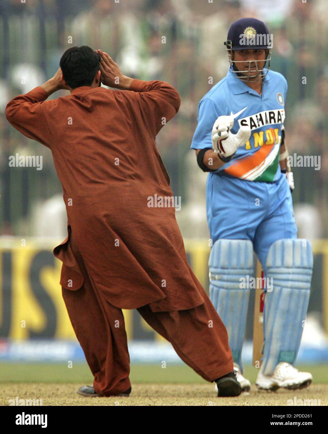 Pakistani cricket fan, left, salutes India's Sachin Tendulkar after ...