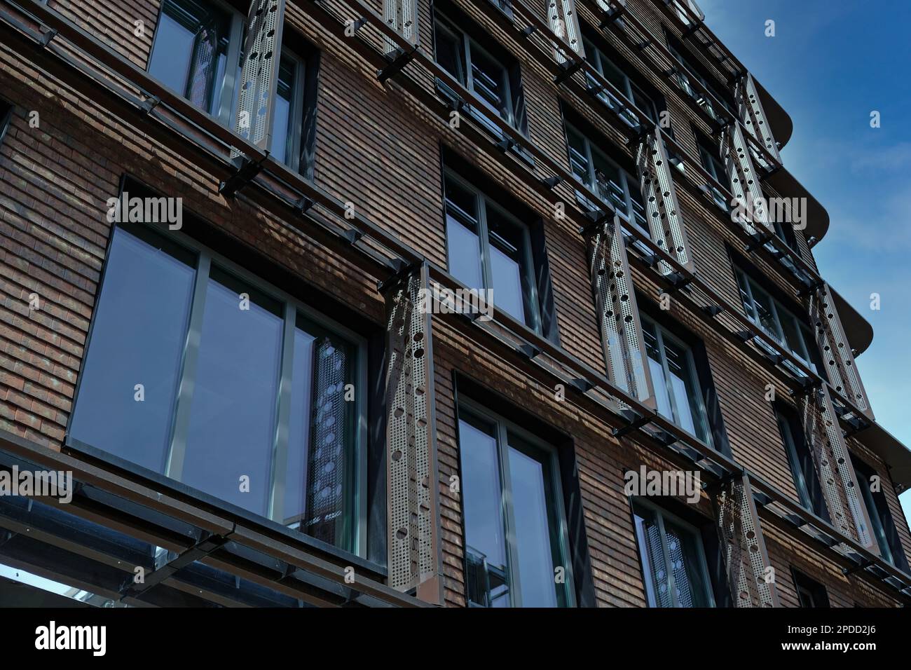 Exterior of modern red brick house with metal inserts. Architectural ...