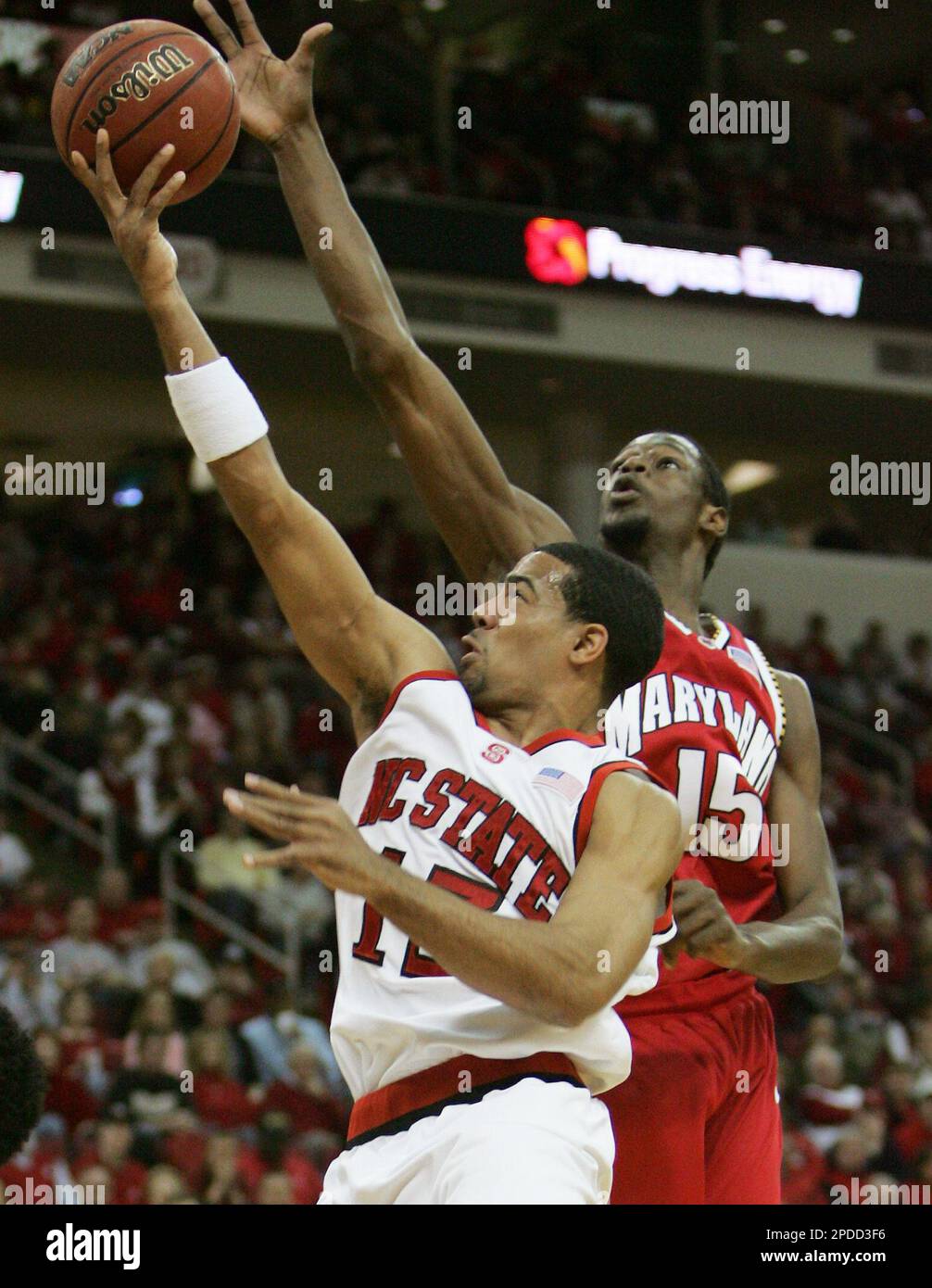 North Carolina State's Cameron Bennerman, left, tries to shoot as ...