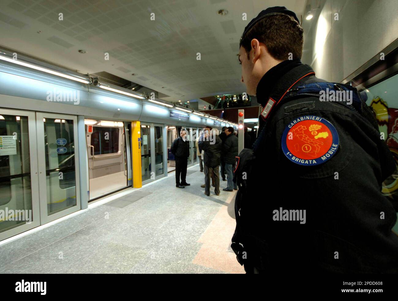 A Carabinieri paramilitary officer guards the platform by a subway ...