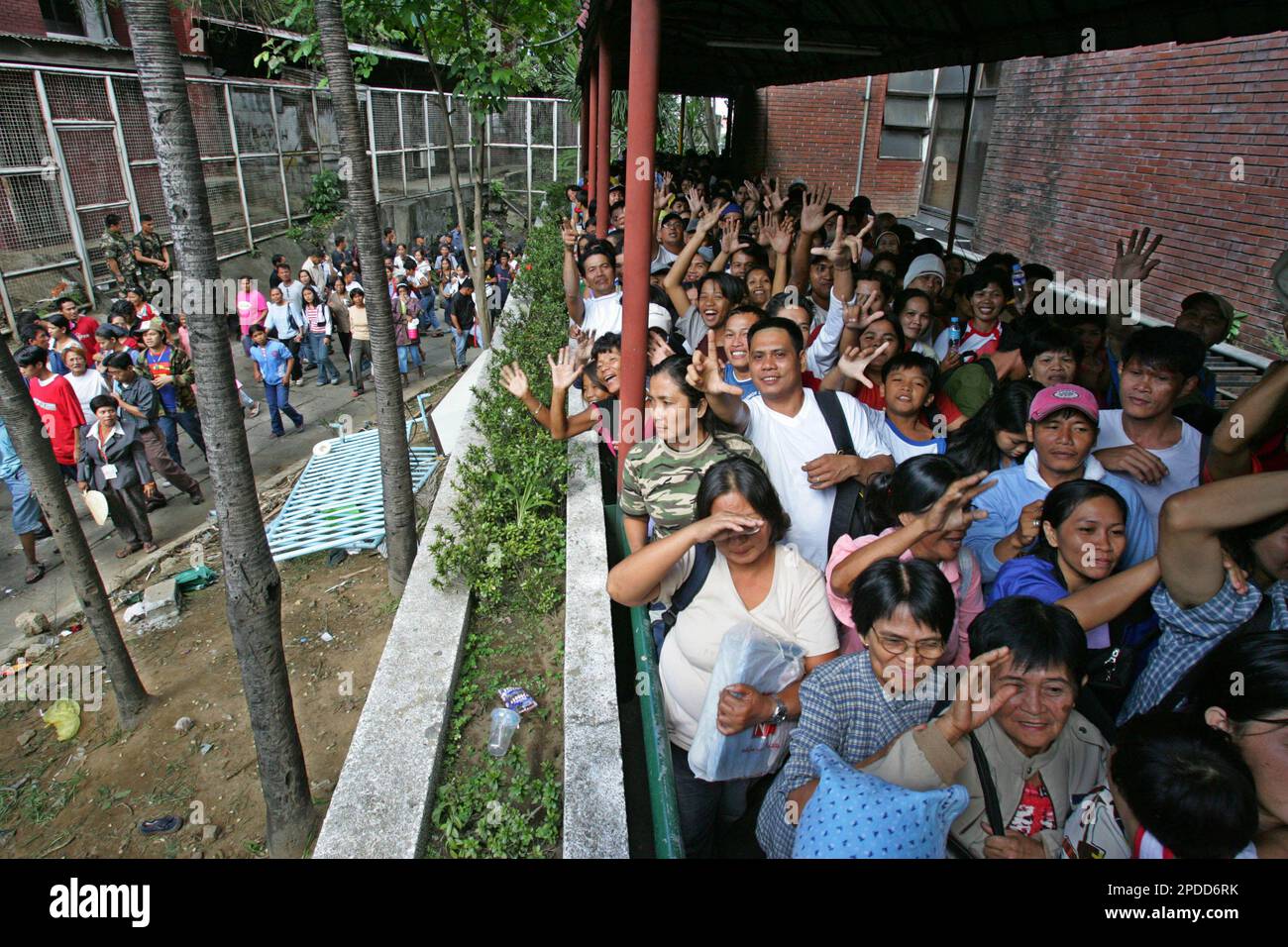 Fans file past to exit the gymnasium after hearing the postponement of ...
