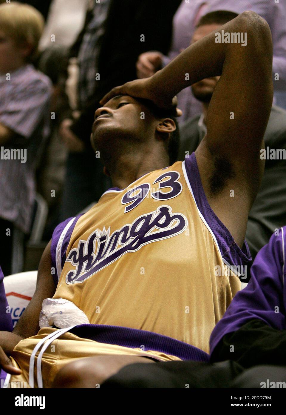 Sacramento Kings forward Ron Artest sits on the bench with an ice pack ...