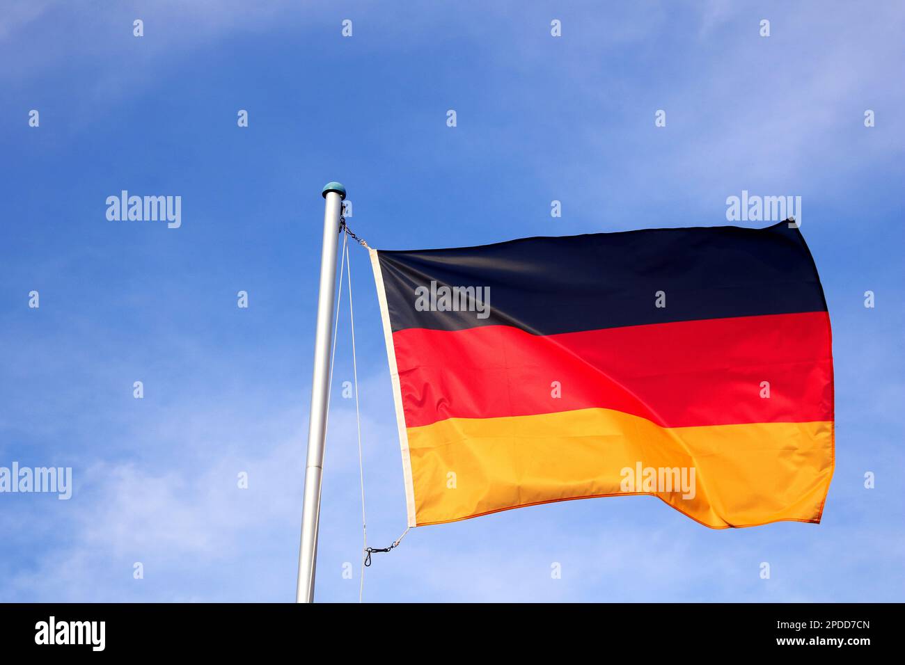 German flag against blue sky hi-res stock photography and images - Alamy