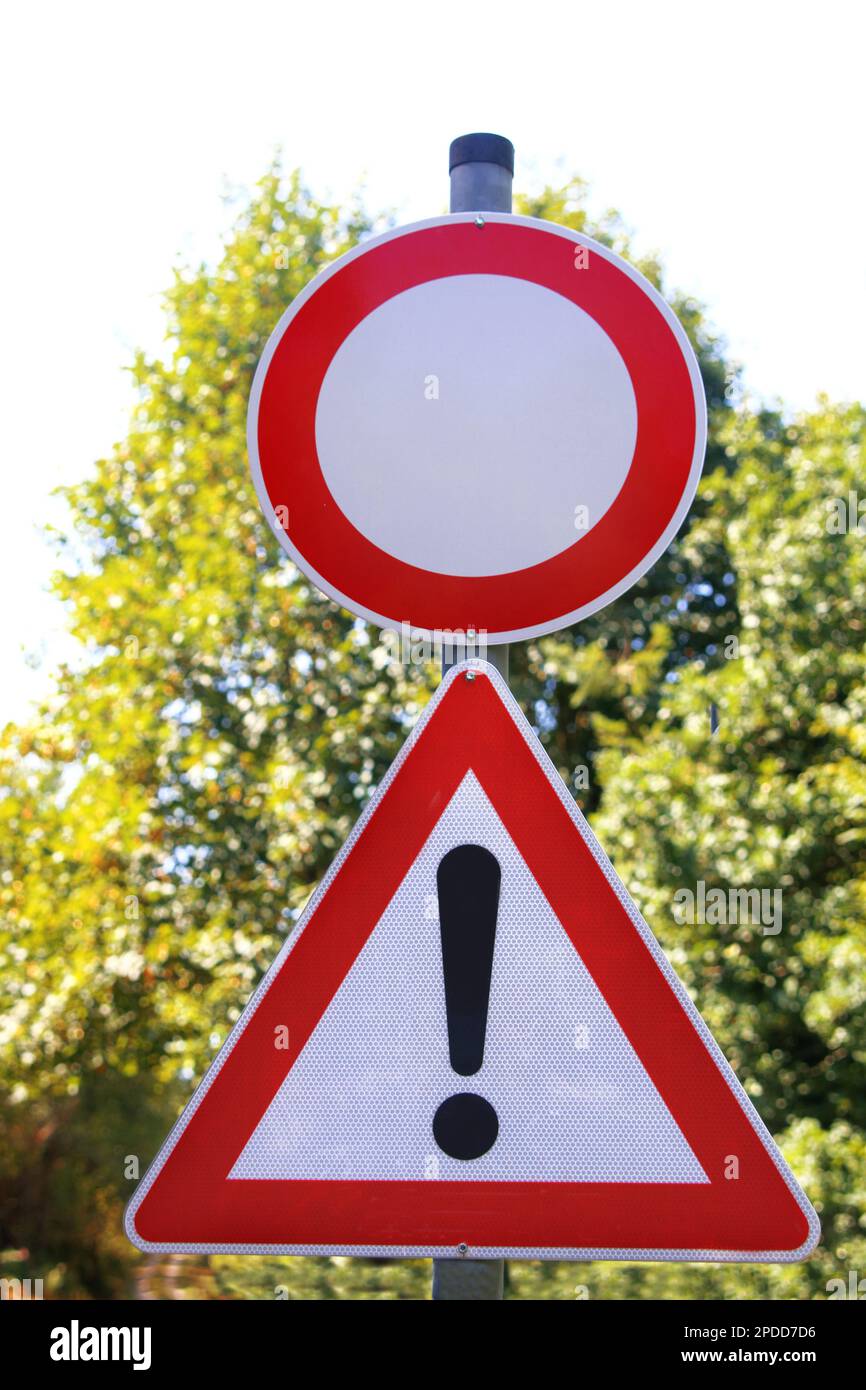 road sign passage prohibited, and Caution, danger point! Stock Photo ...