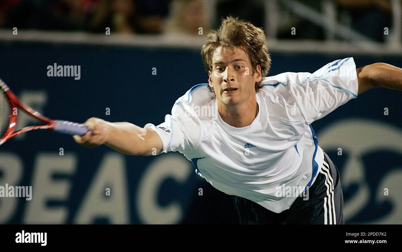 Florian Mayer from Germany stretches trying to reach a ball hit by ...