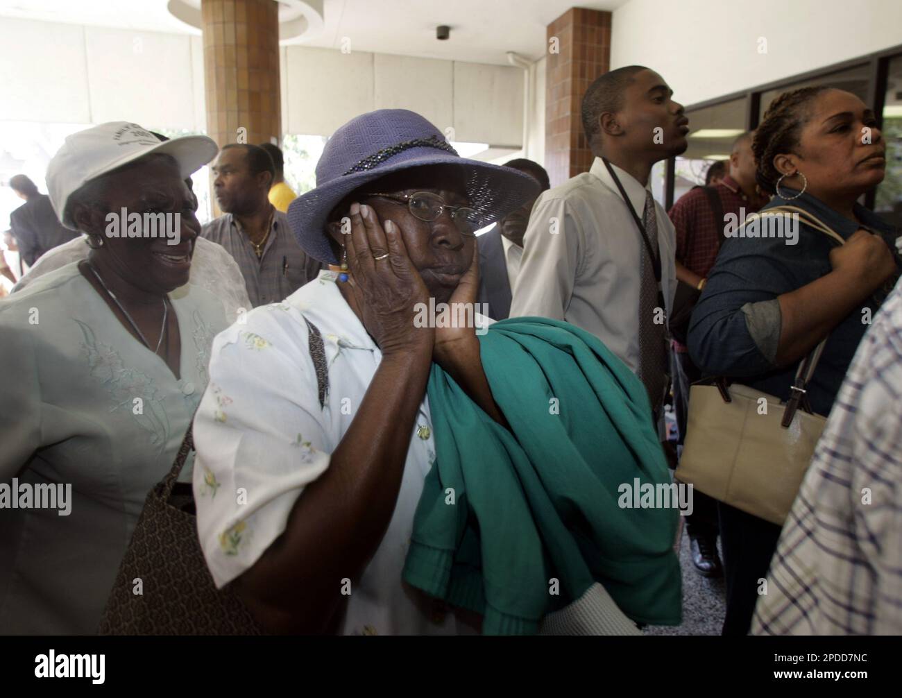 Supporters of the Rev. Gerard Jean-Juste, not shown, Friday, Feb. 3 ...