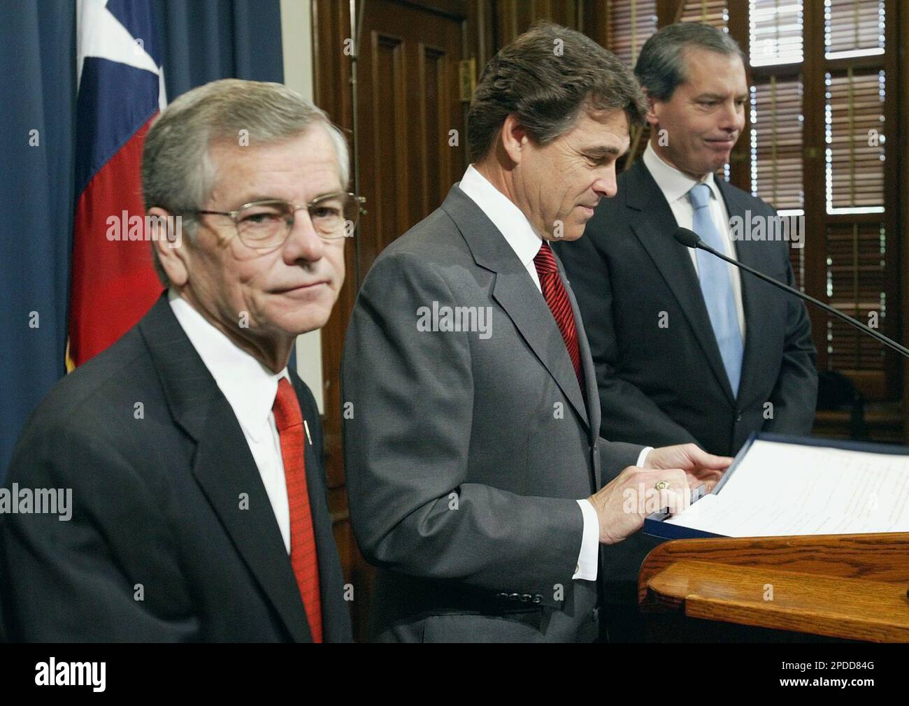 Texas House Speaker Tom Craddick, R-Midland, left, Gov. Rick Perry and ...