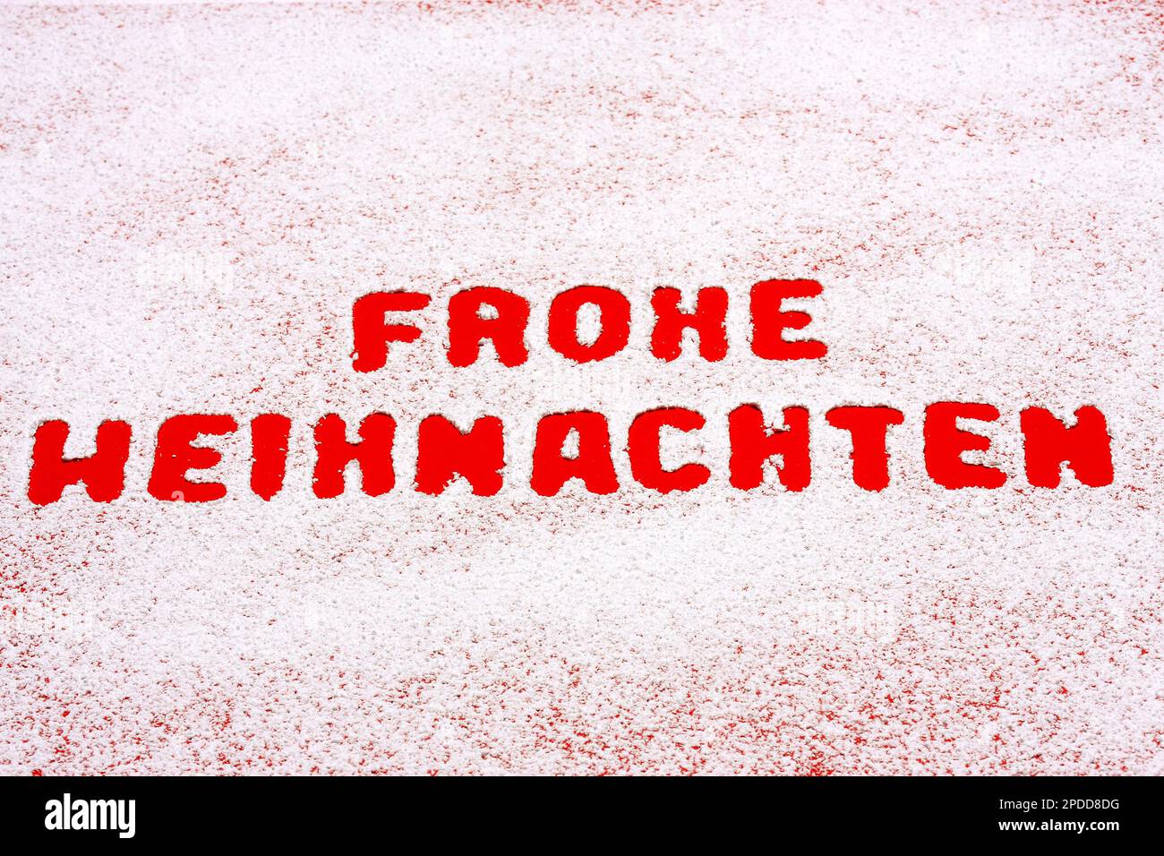 red writing Frohe Weihnachten, Merry Christmas, on snow Stock Photo - Alamy