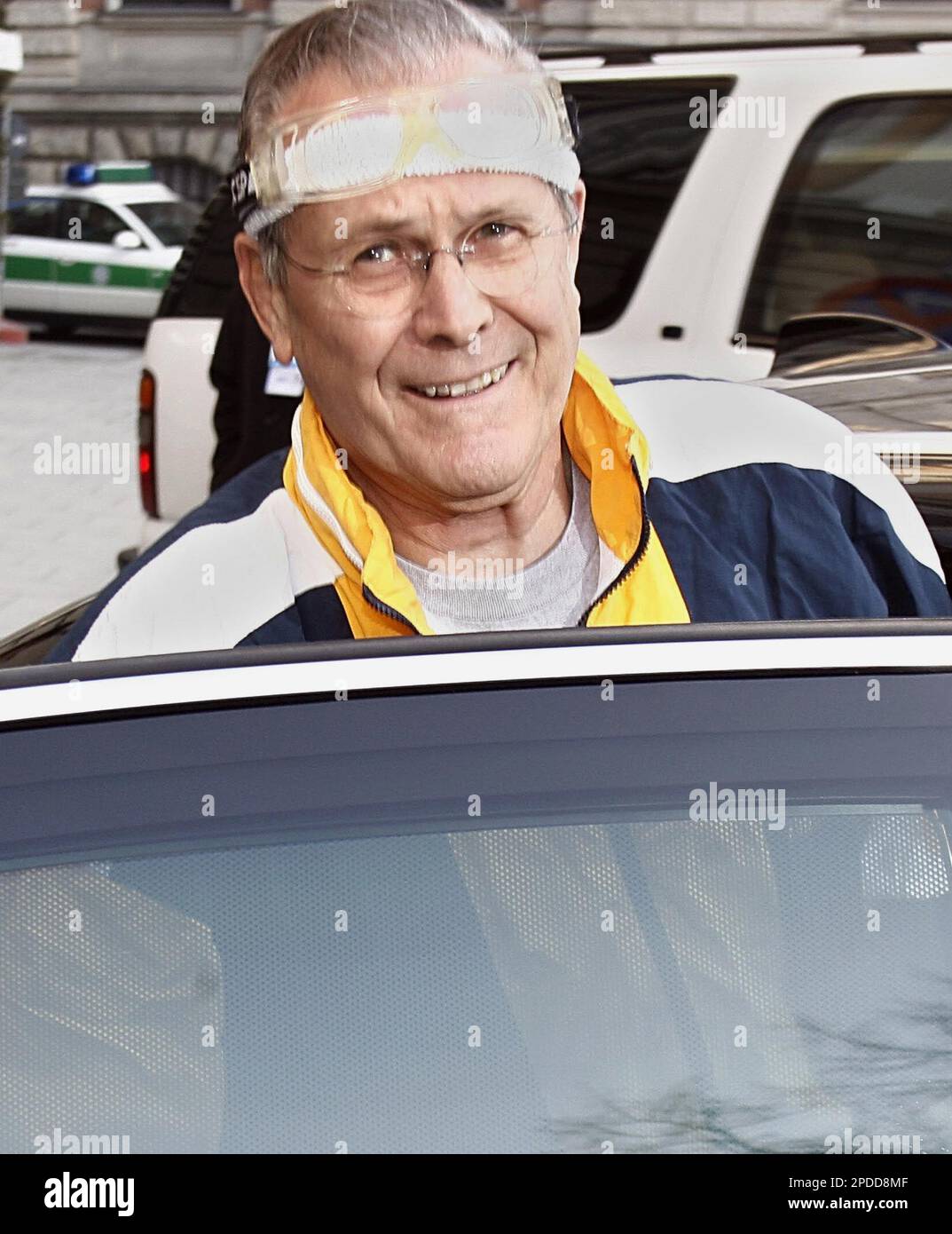 US Defense Secretary Donald Rumsfeld, wearing a workout outfit, enters ...