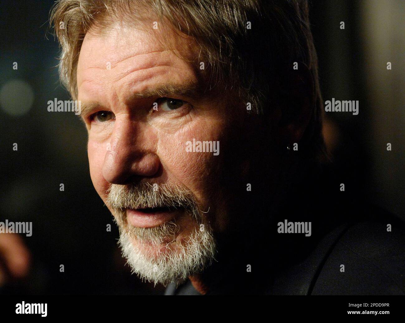 Harrison Ford, star of the new film "Firewall," looks along the red ...
