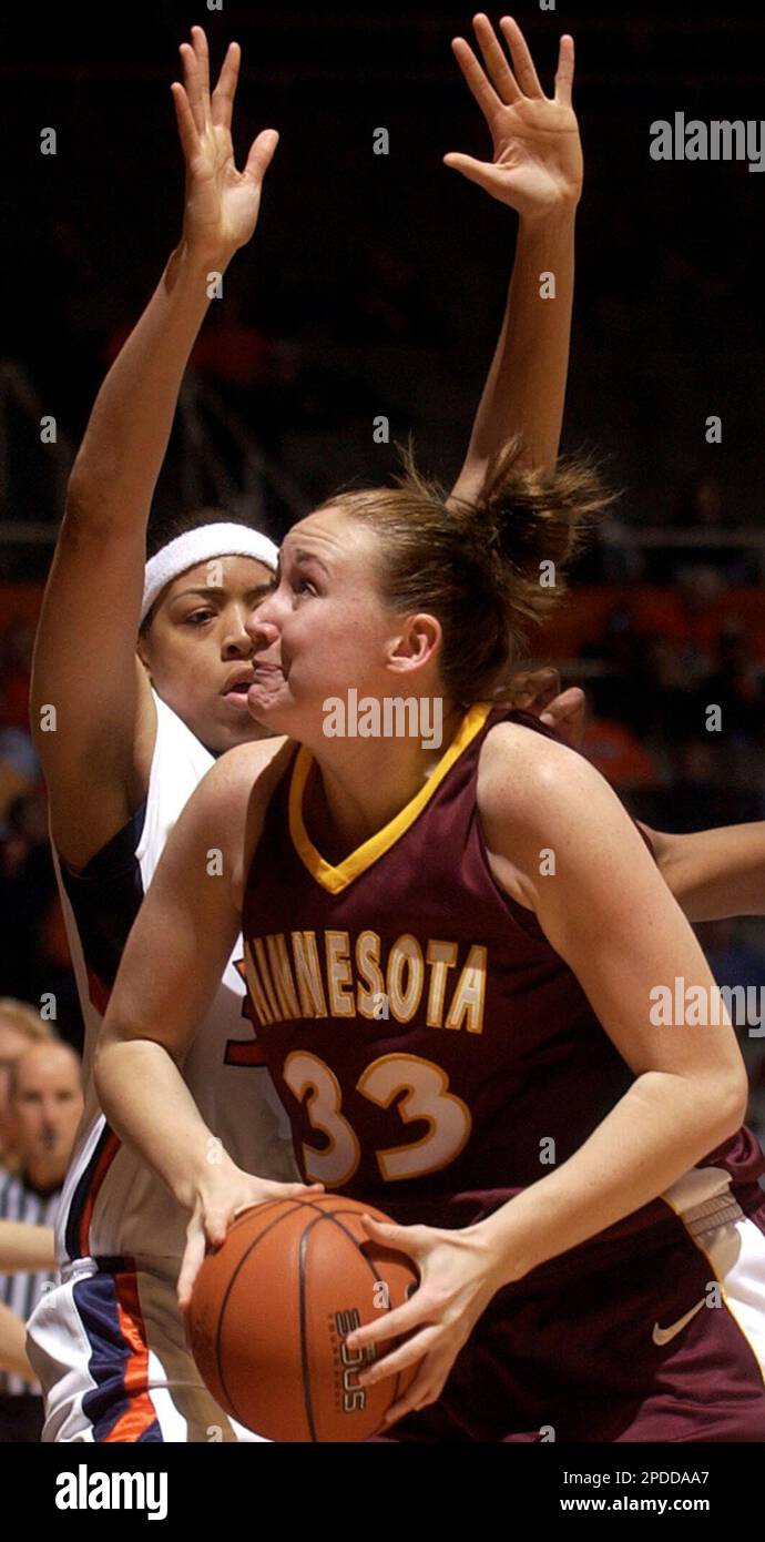Minnesota's Jamie Broback prepares to shoot over Illinois' Danyel ...