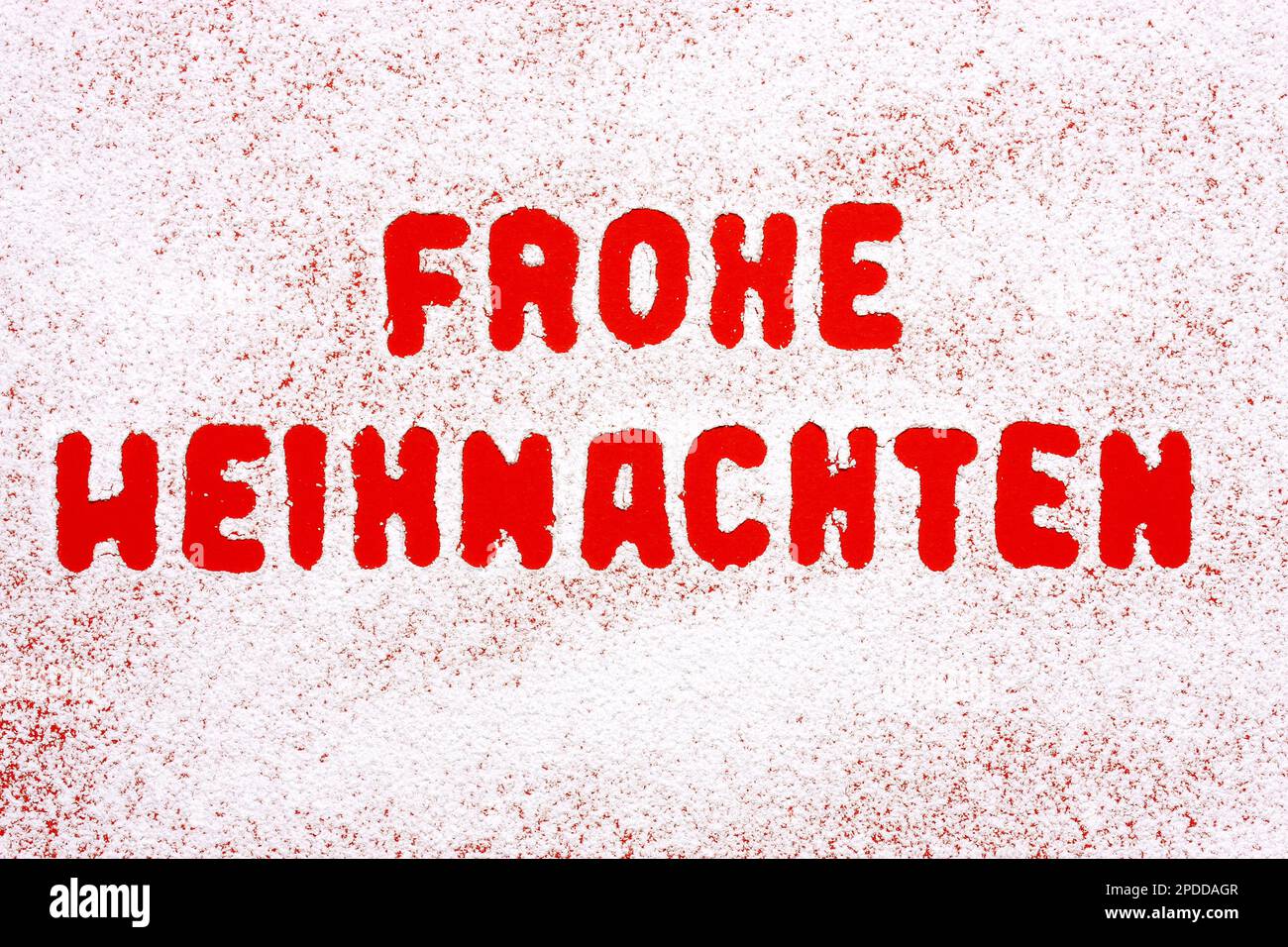 red writing Frohe Weihnachten, Merry Christmas, on snow Stock Photo - Alamy