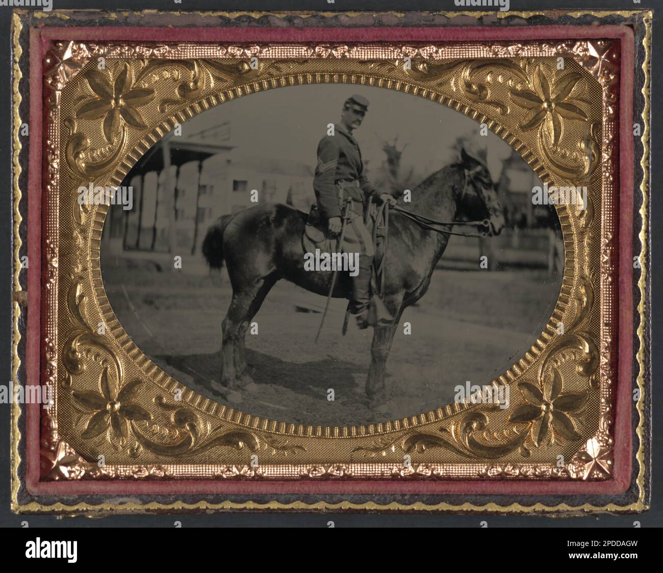 Unidentified soldier in Union sergeant's uniform with sword seated on a ...