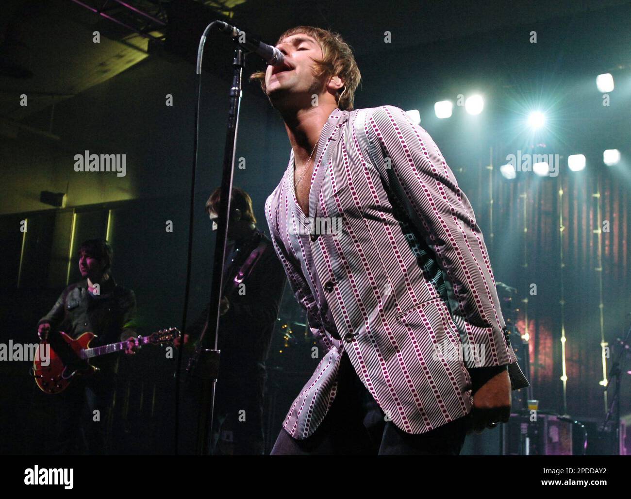 Liam Gallagher, singer of British rock group Oasis, performs on stage ...