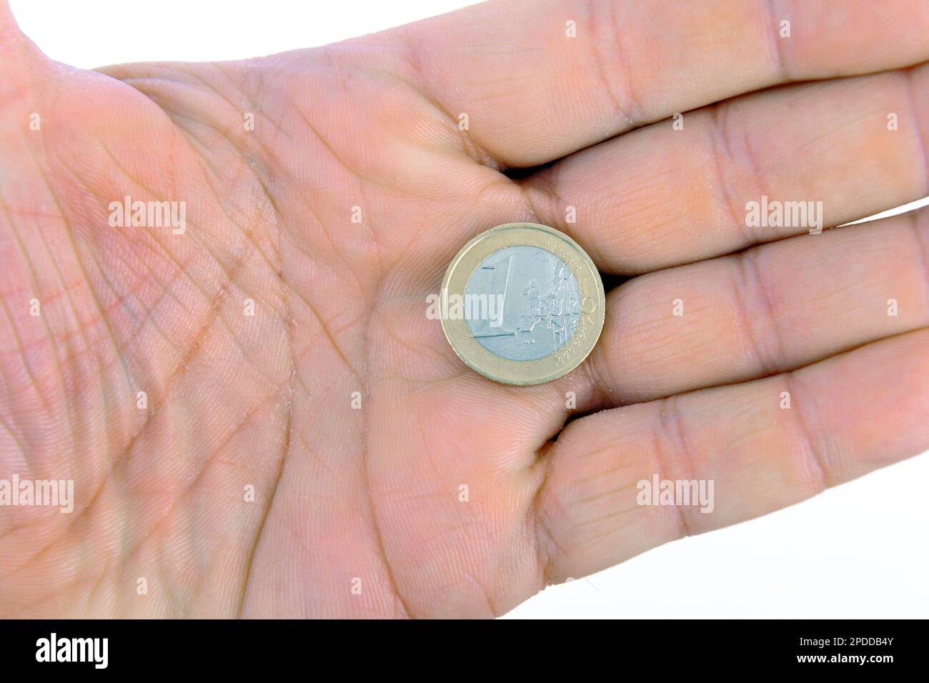 an Euro coin in a hand, Europe Stock Photo - Alamy