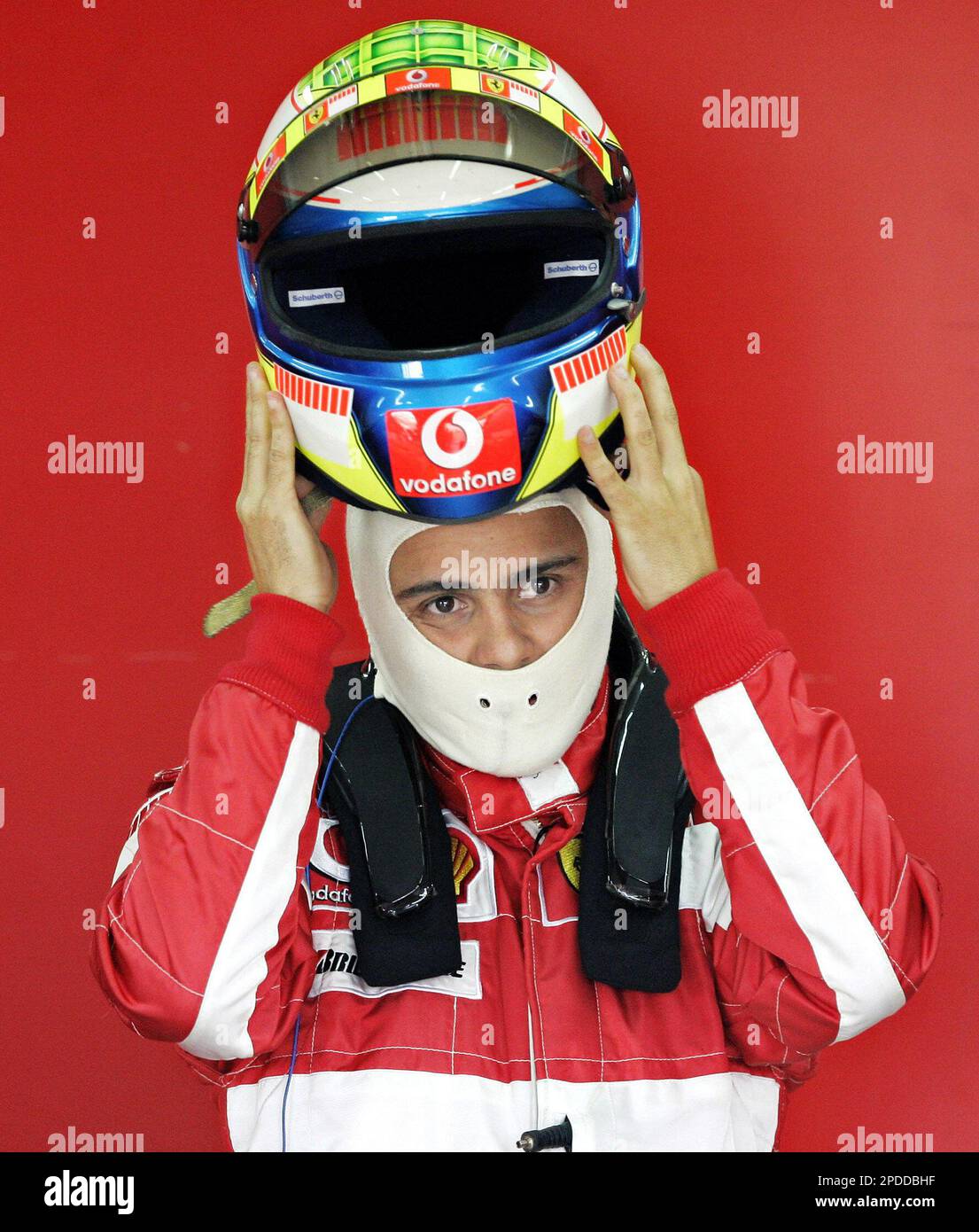 Ferrari driver Felipe Massa from Brazil put his helmet before a F1 ...