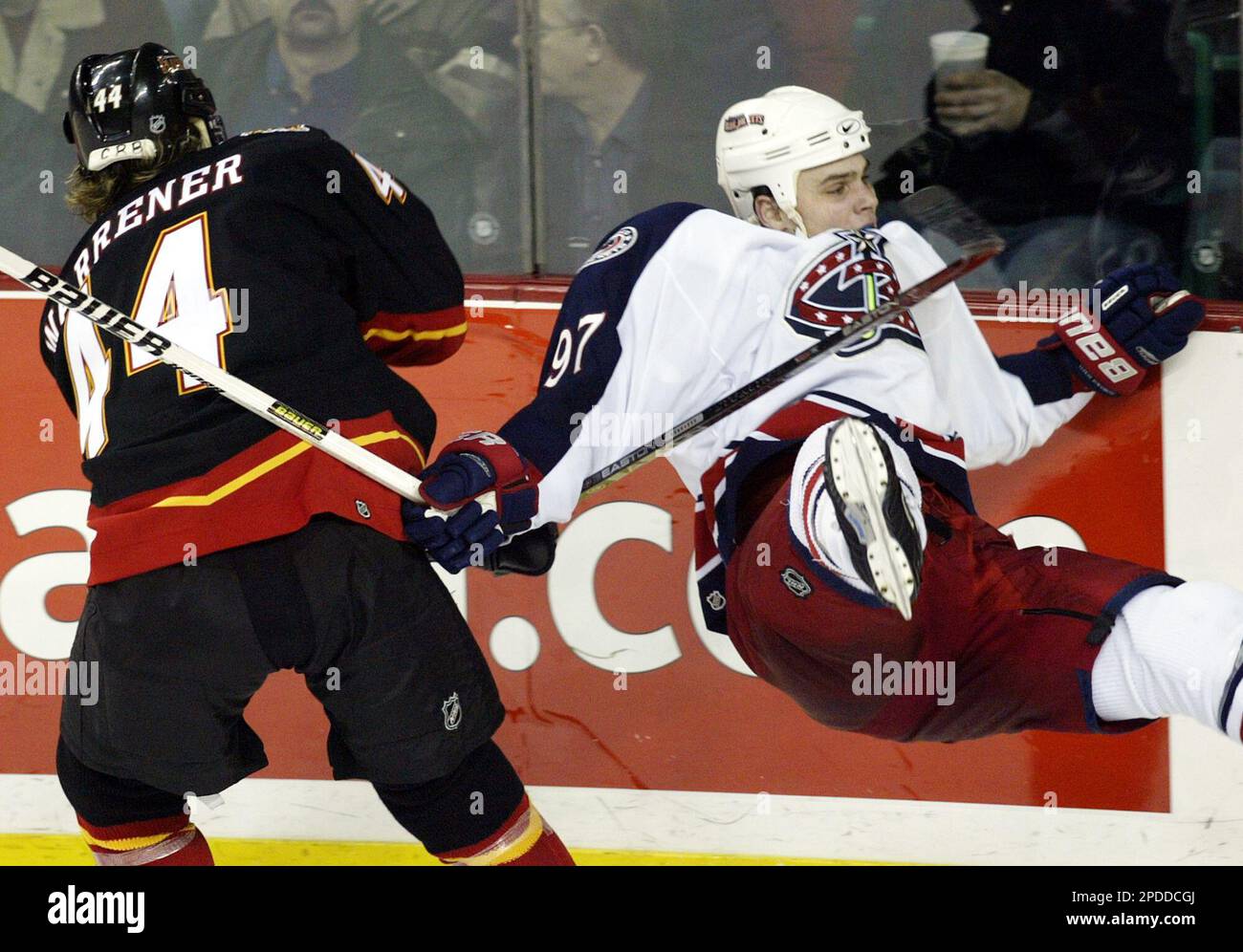 Columbus Blue Jackets Rotislav Klesla (97) gets up ended by Calgary ...