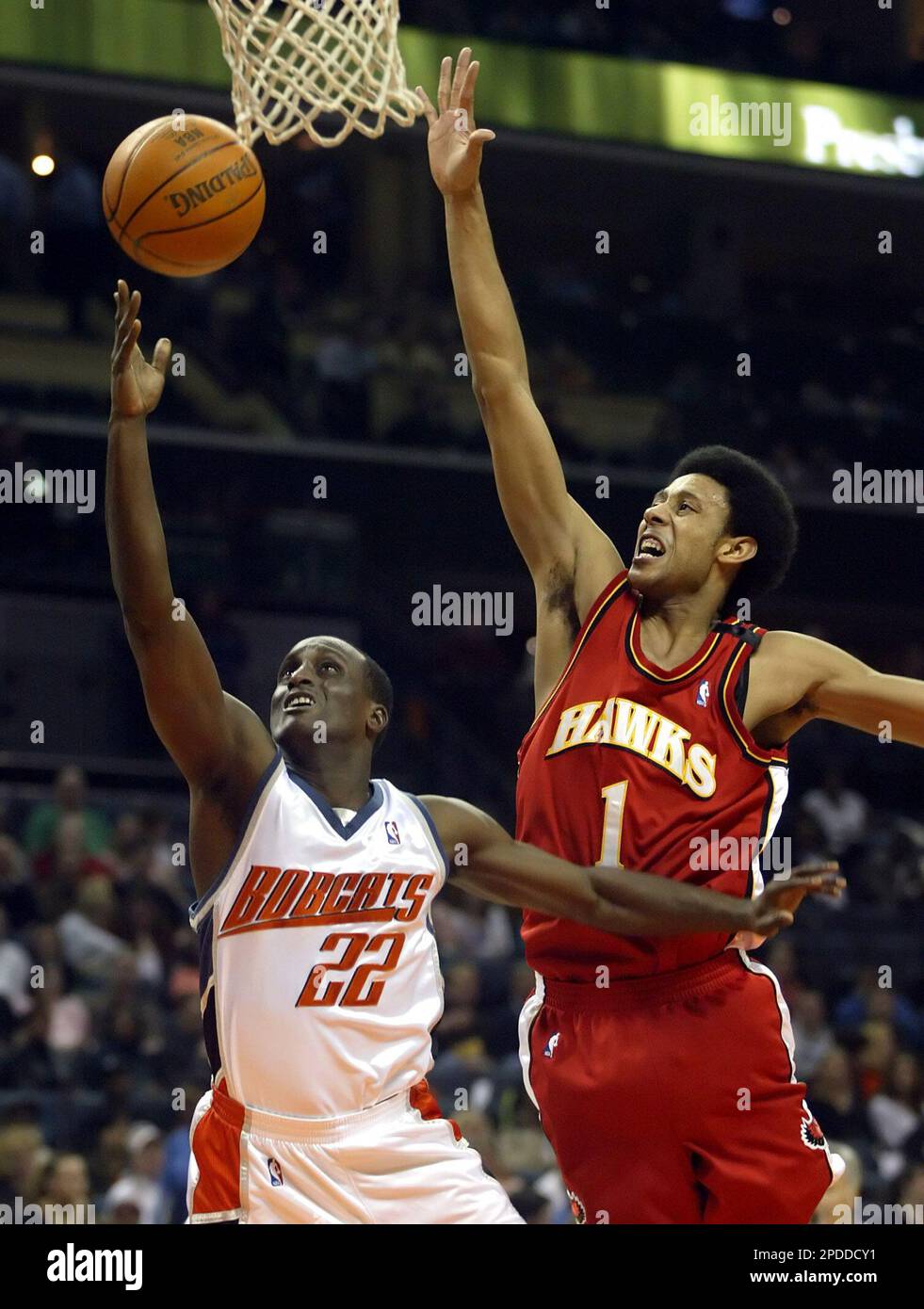 Charlotte Bobcats guard Brevin Knight, left, drives past Atlanta Hawks ...