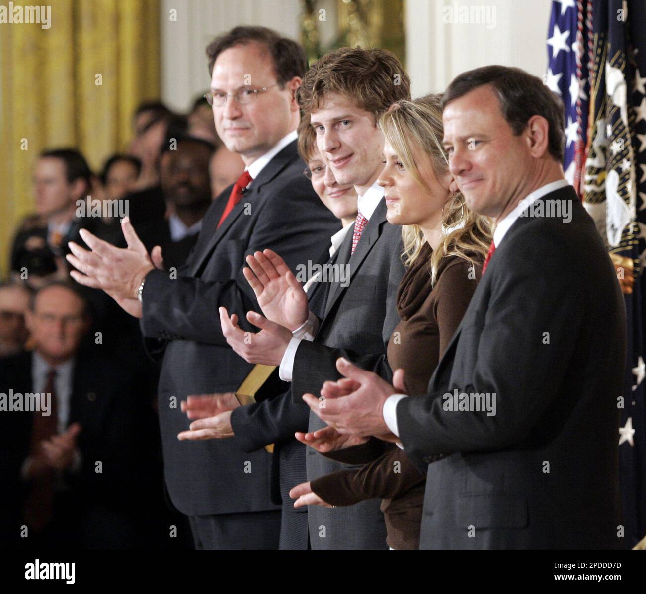 New Supreme Court Justice Samuel Alito,left, applauds with his family ...