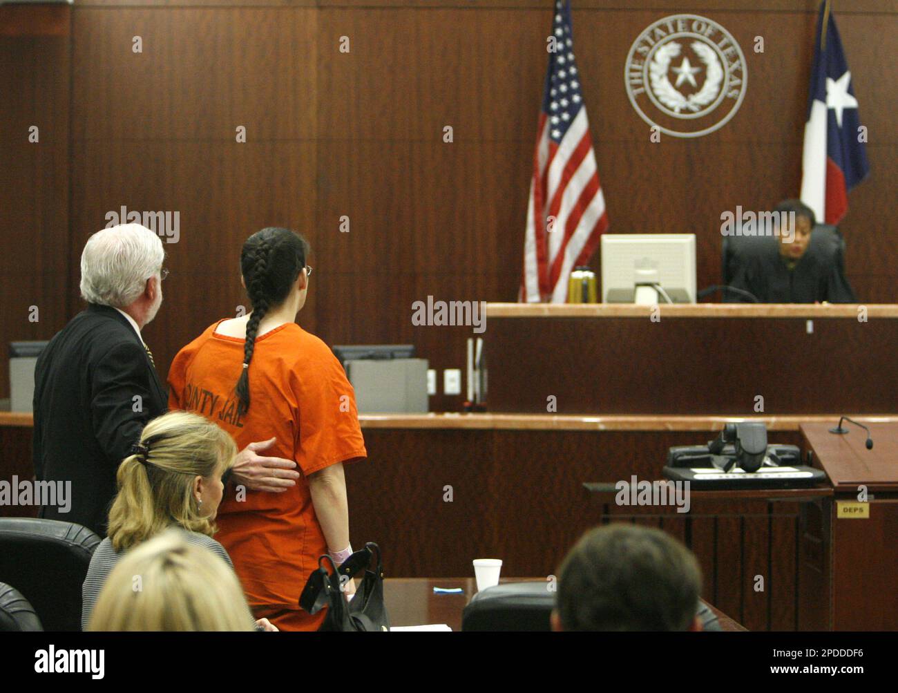 Defense attorney George Parnha, left, comforts accused child-killer ...