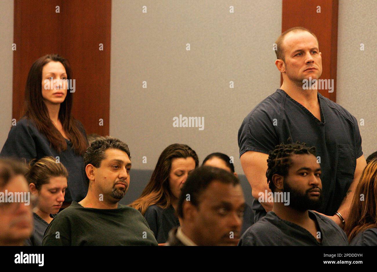 Husband and wife professional bodybuilders Craig Titus, right, and ...