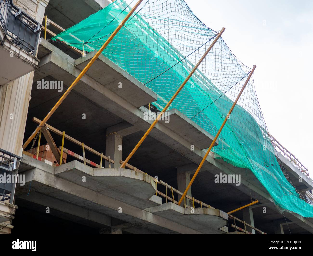 Building construction. Construction site safety net. Construction ...