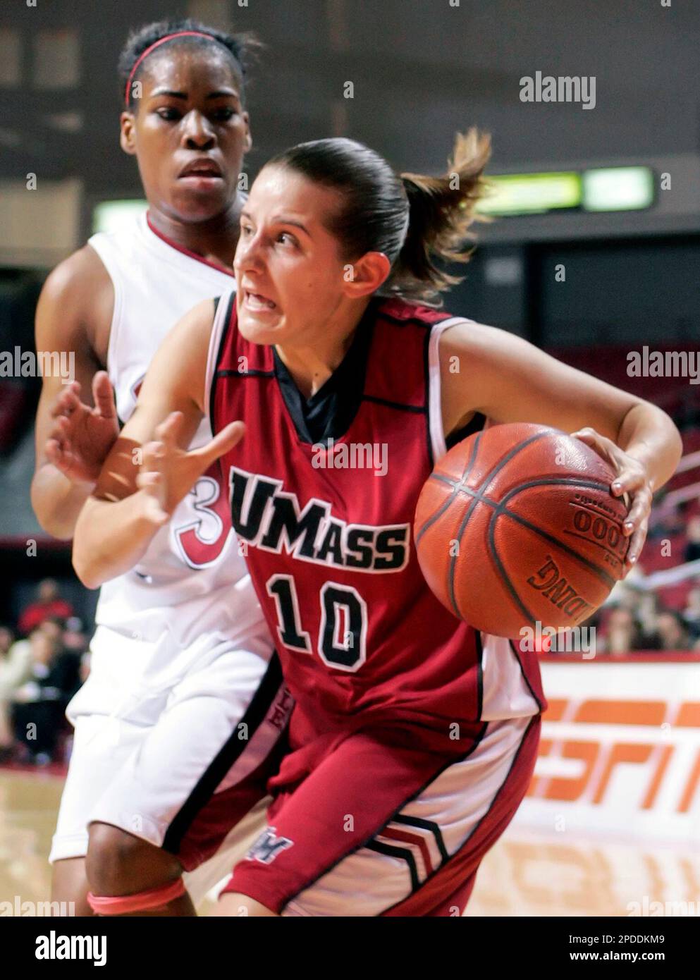 Massachusetts' Katie Nelson (10) is guarded by Temple's Fatima Maddox ...