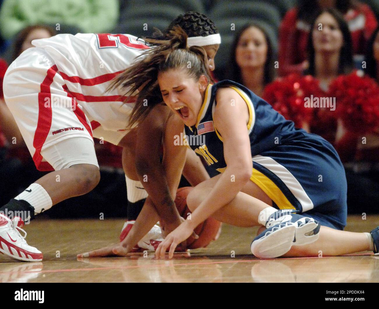 West Virginia's Meg Bulger, right, screams after injuring her left knee ...