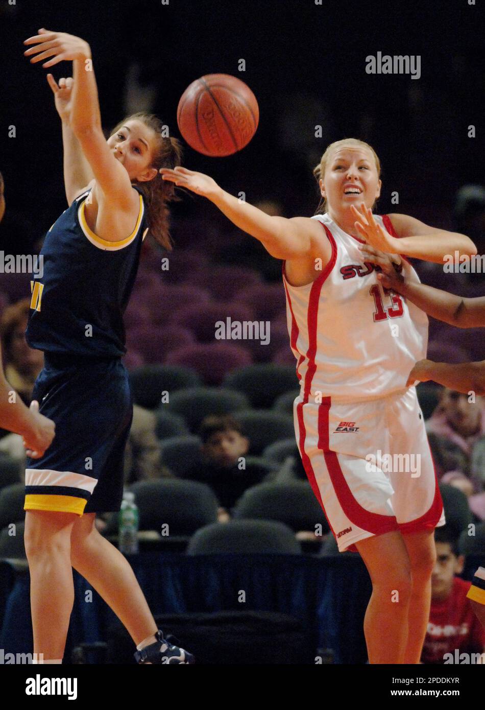 St. John's Tiina Sten, right, of Turku, Finland, goes for a loose ball ...
