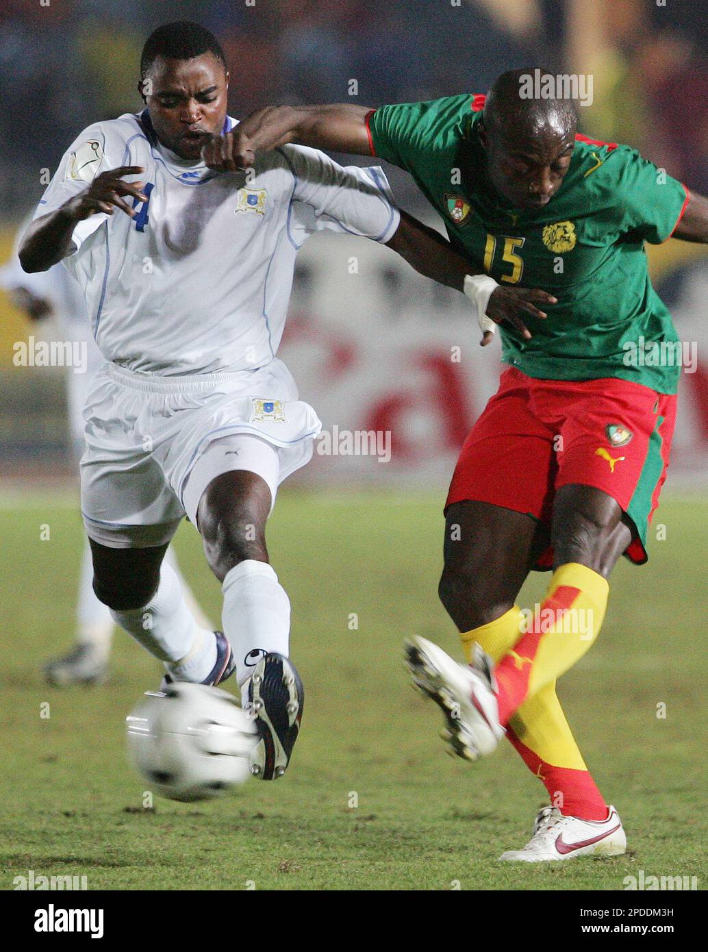 Cameroon's Pierre Webo, right, kicks the ball past Congo's Ticko Tshiolola during the African ...