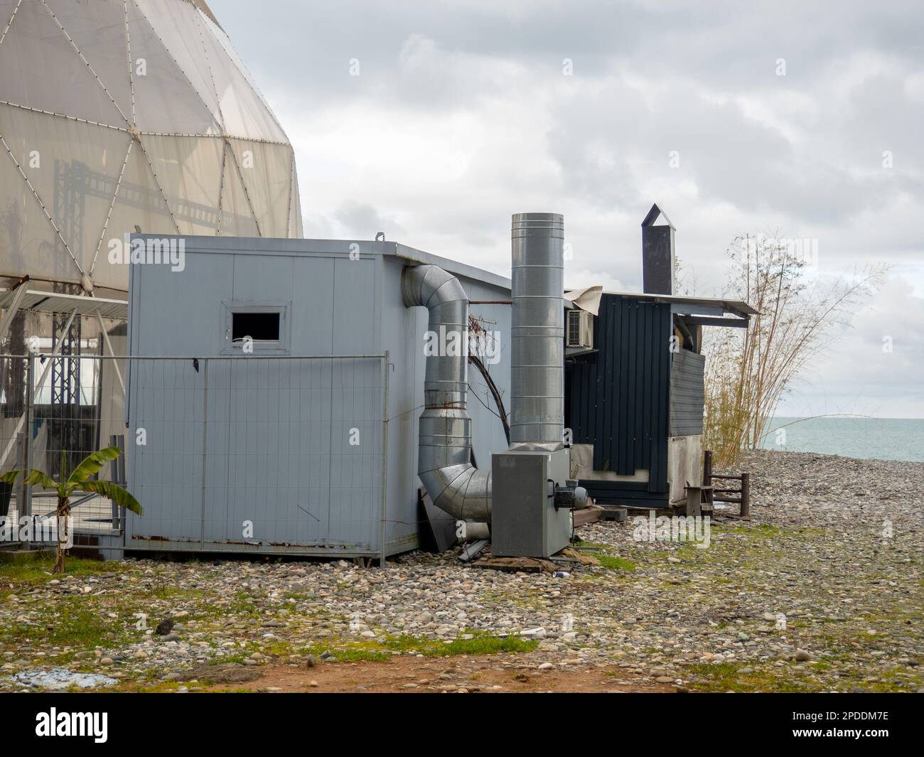 Utility room on the street. Maintenance booth. Equipment. Car with ...