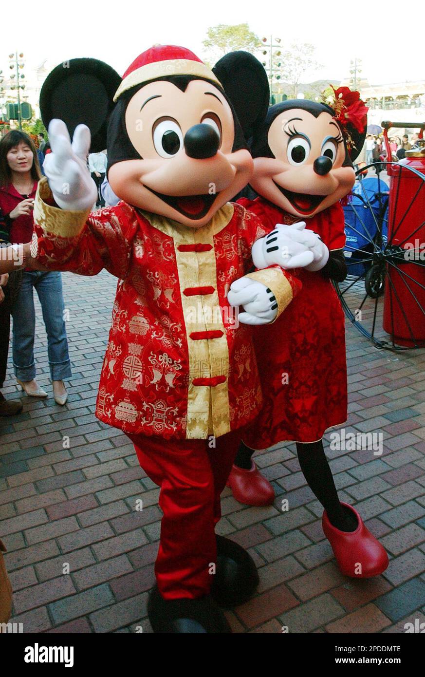 Mickey Mouse and Minnie Mouse dressed in Chinese traditional new year ...