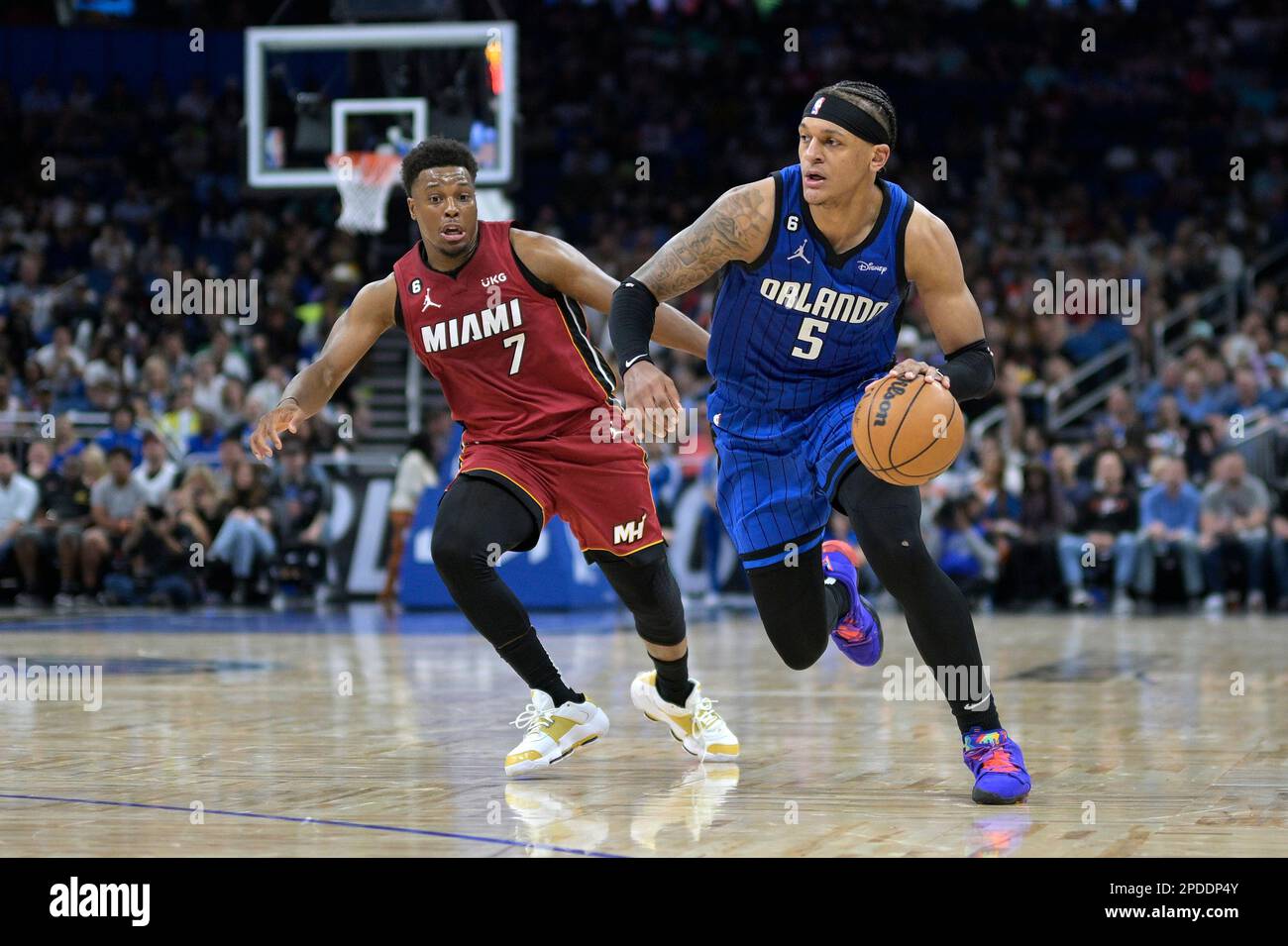 Orlando Magic forward Paolo Banchero (5) is defended by Miami Heat ...