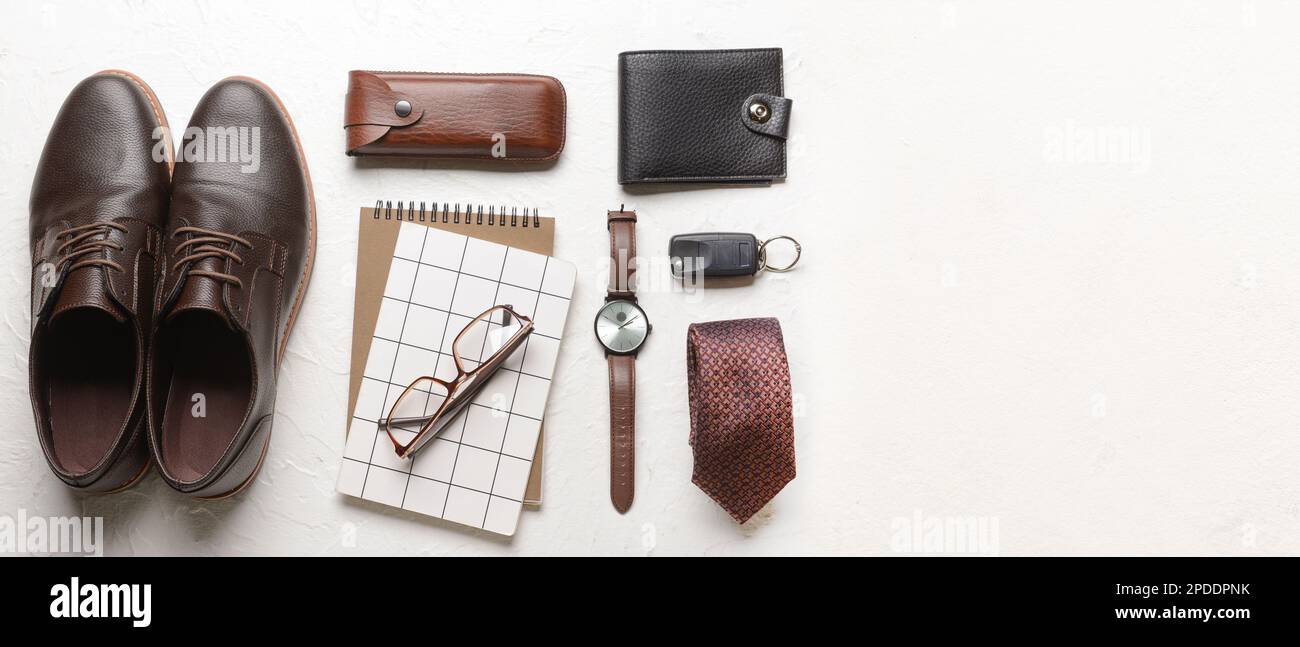 Set of stylish male accessories with notebooks on light background with ...