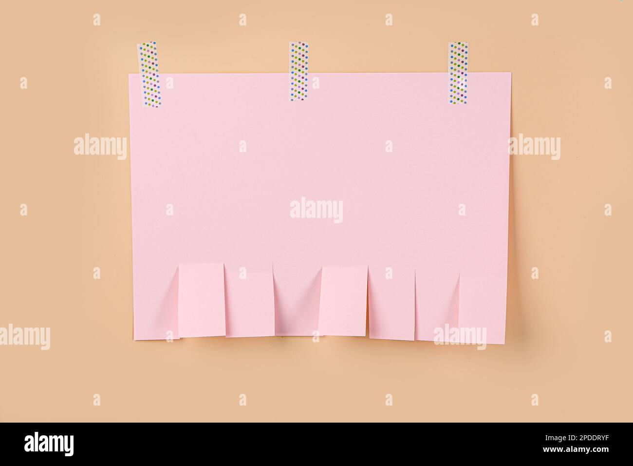 Blank paper tear-off ad on beige background Stock Photo - Alamy