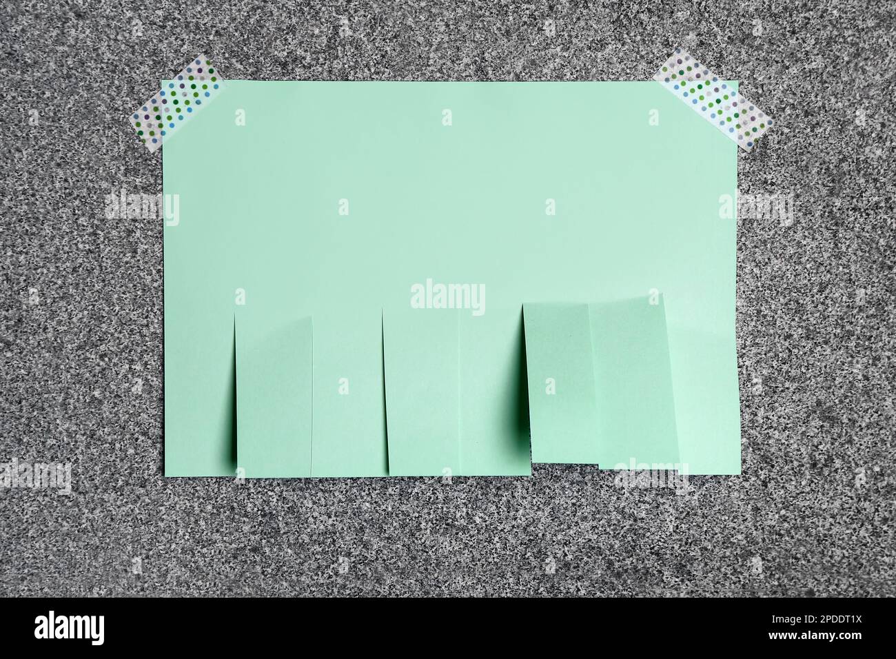 Blank paper tear-off ad on granite wall Stock Photo - Alamy