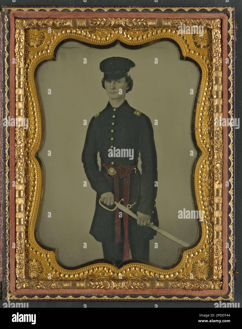 Unidentified soldier in Confederate uniform and red sash with sword ...