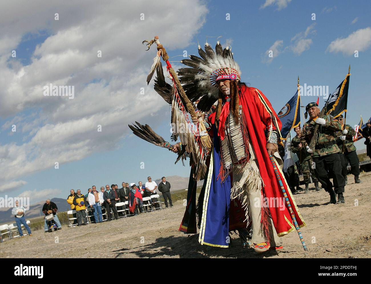Leroy Spotted Eagle, of Paiute tribe, marches to the victory drum song ...