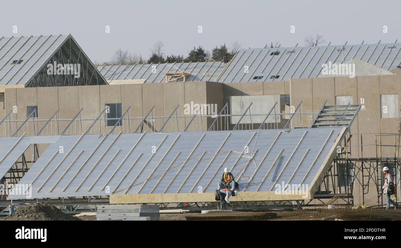 Workers construct roof sections for new barracks at Fort Riley, Kan ...