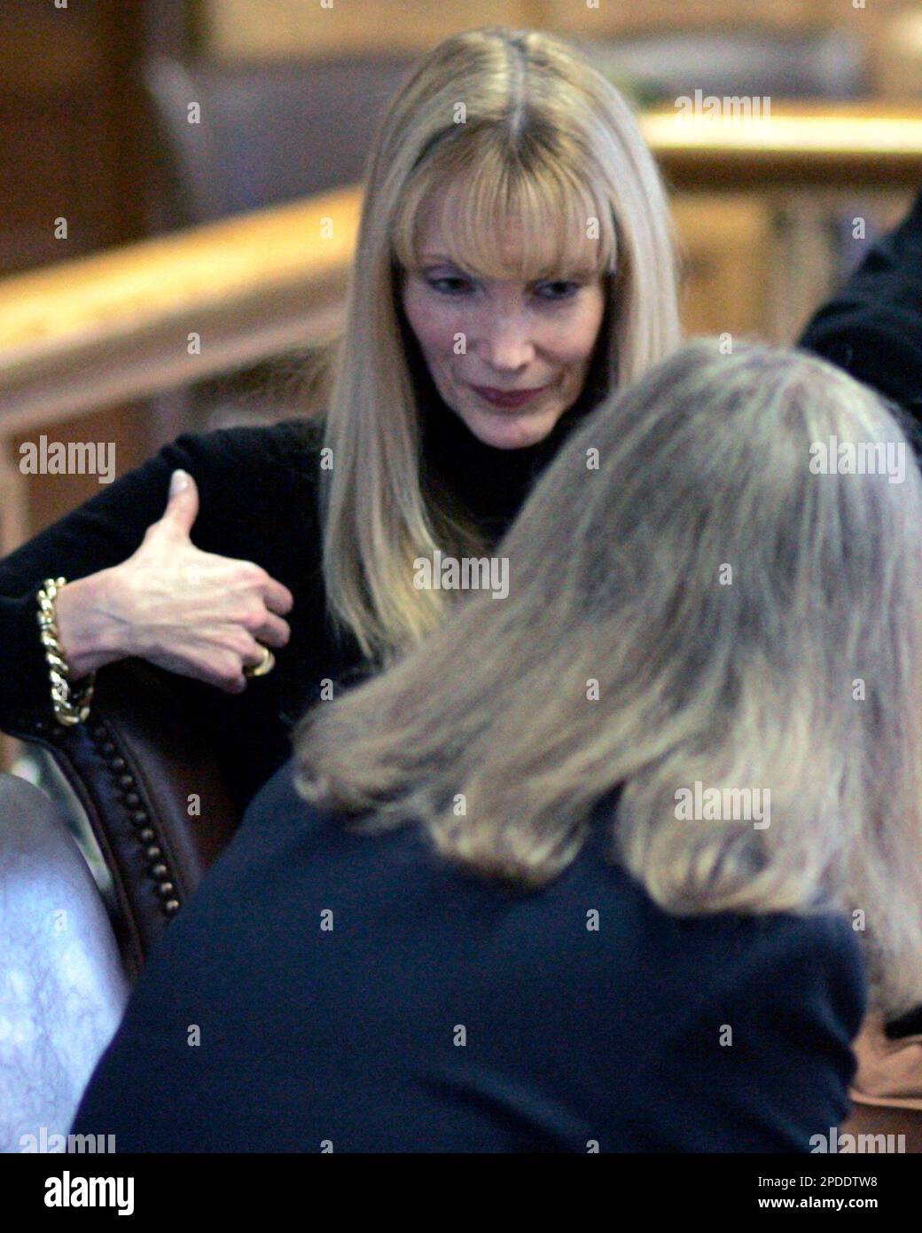 Barbara Asher, left, speaks with her lawyer Stephanie Page in the ...