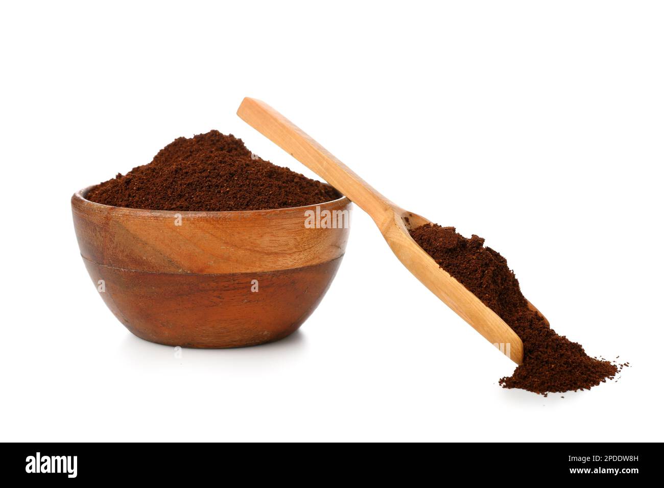 Wooden scoop and bowl with coffee powder isolated on white background ...
