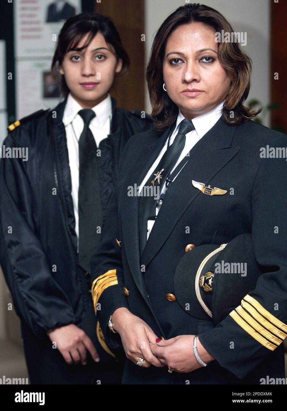 Pakistani female pilot Ayesha Rabia Naveed, right, with her co-pilot ...