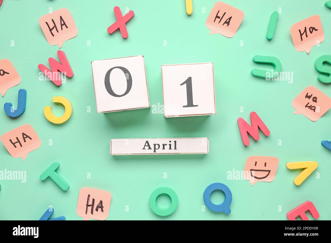 Date of April Fool's Day with letters and sticky papers on color ...