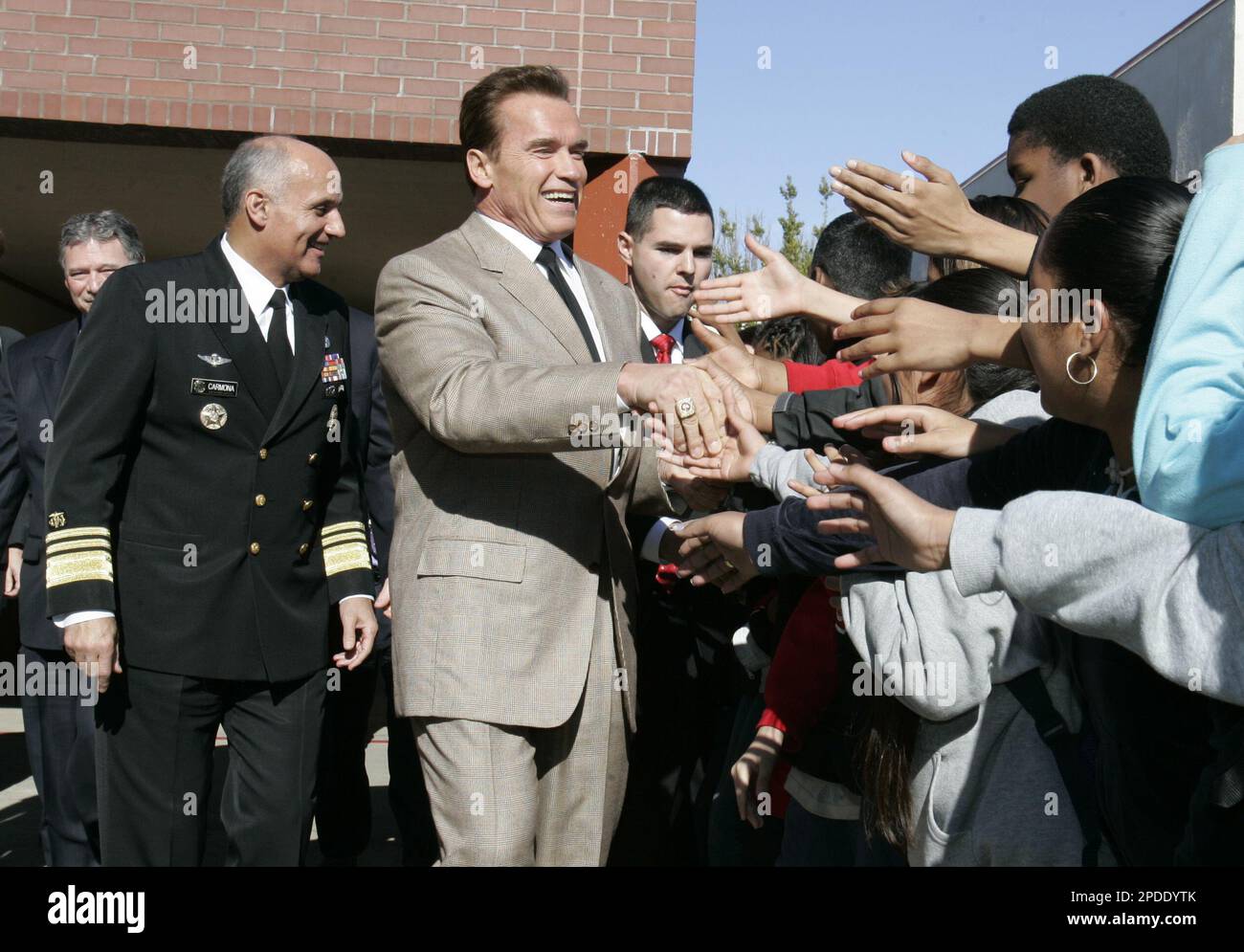 California Gov. Arnold Schwarzenegger, second from left, shakes hands ...