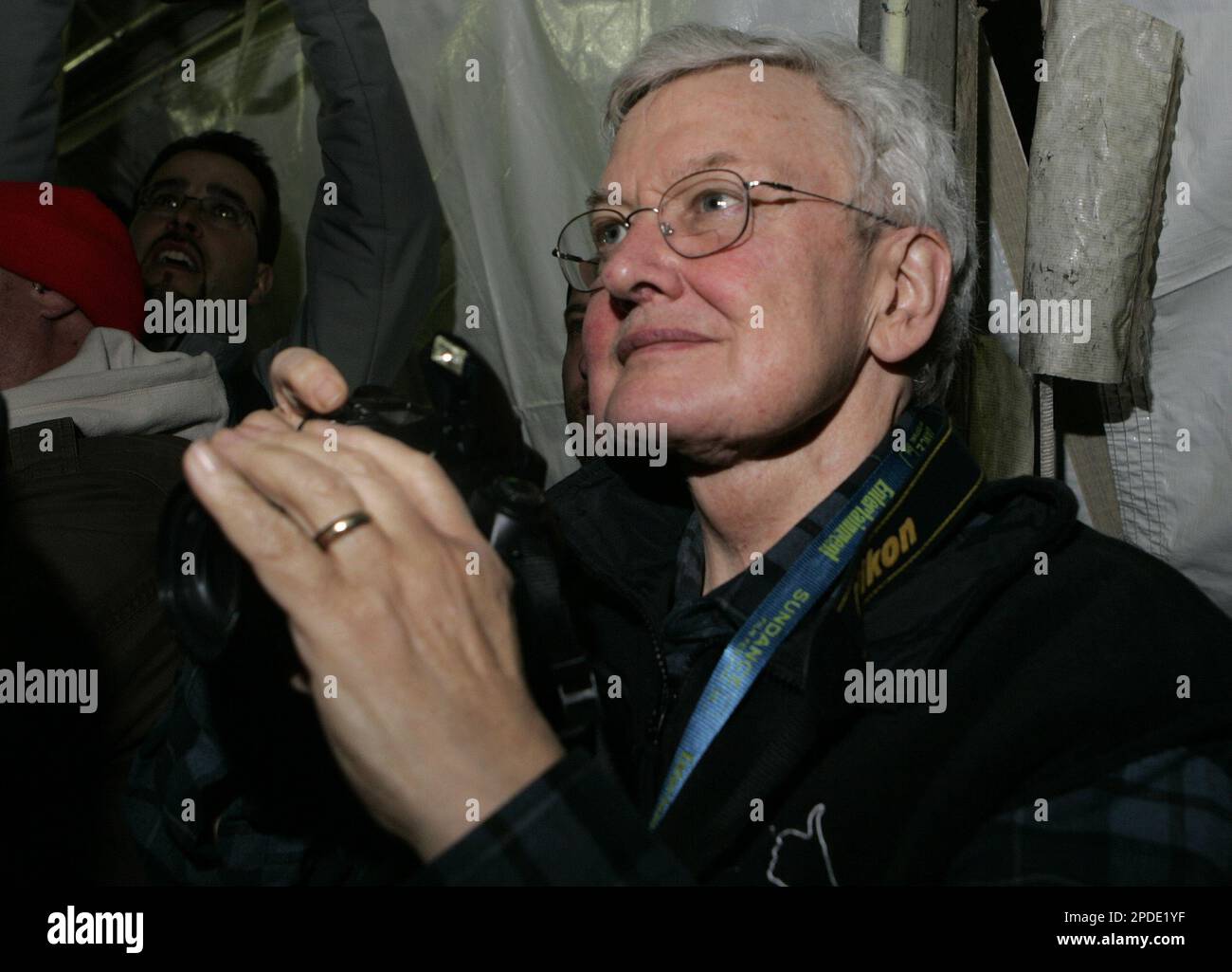 Movie critic Roger Ebert photographs "The Darwin Awards" director Finn ...