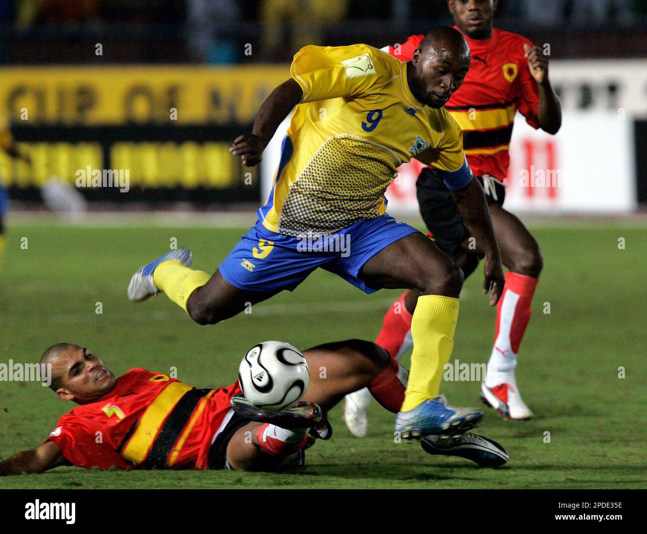Congo's Lomana Tresor Lua Lua evades a tackle by Angola's Carlos Alonso ...