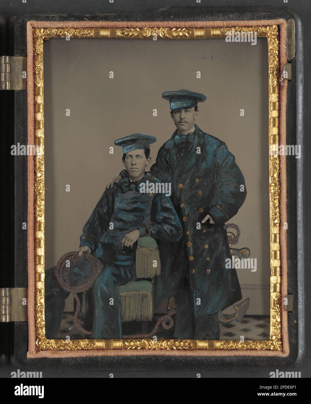 Two unidentified sailors in Union uniforms with rope and anchor ...