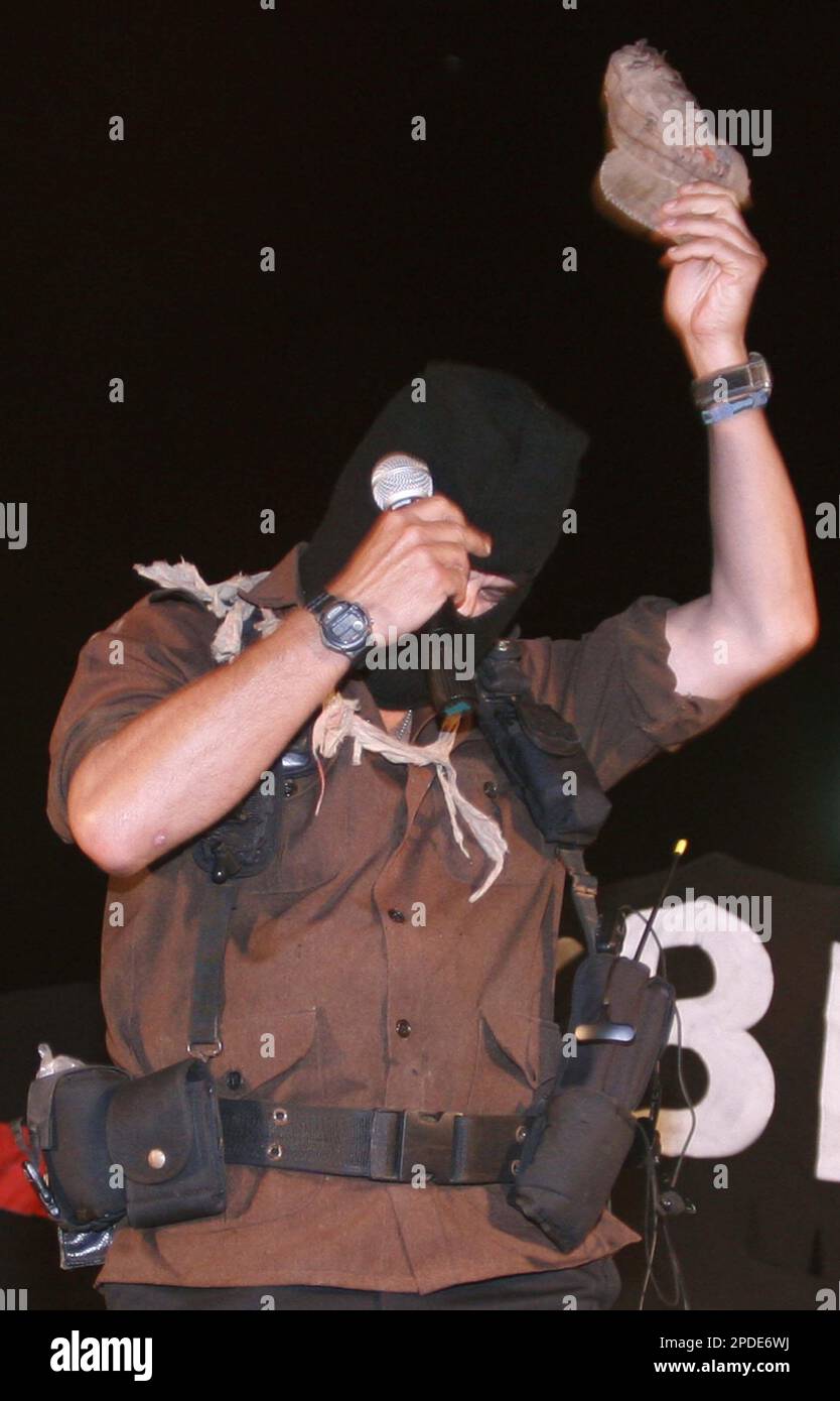 Zapatista rebel leader Sub Comandante Marcos surprises the crowds as he ...