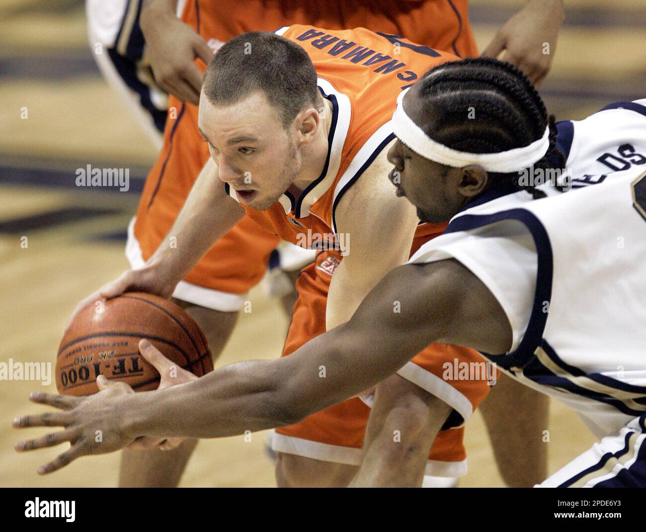 Syracuse's Gerry McNamara, left, drives past Pittsburgh's LeVance ...