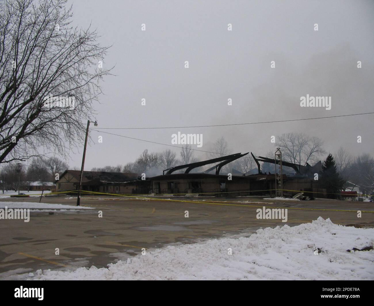 The smoldering remains of the Oskaloosa First Church of the Nazarene in ...